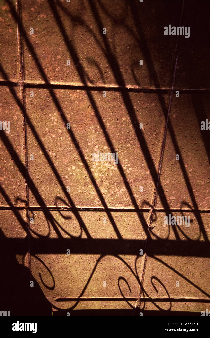 Shadow cast by a wrought iron gate Stock Photo - Alamy
