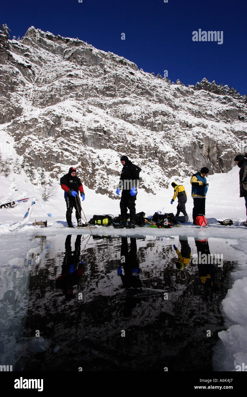 scuba diver with safety rope at an ice hole Stock Photo - Alamy