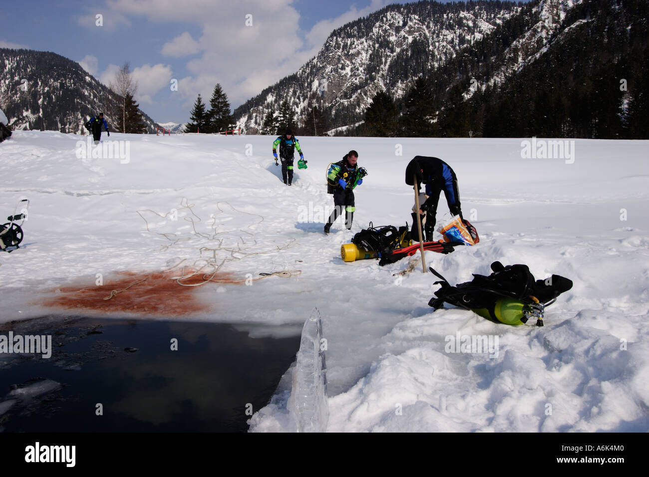 Ice diver diving into frozen lake hi-res stock photography and images ...