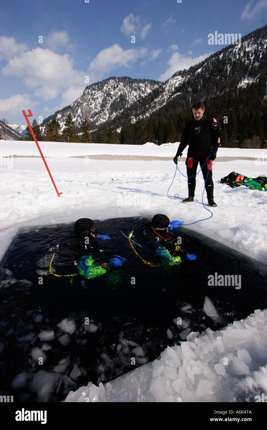 scuba diver with safety rope in ice hole on a frozen lake Stock Photo ...