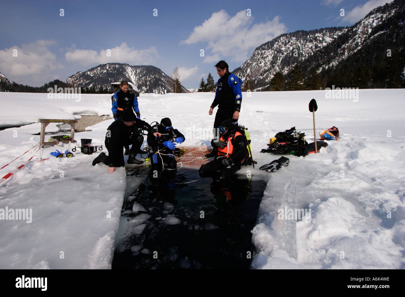 scuba diver with safety rope in ice hole on a frozen lake Stock Photo ...