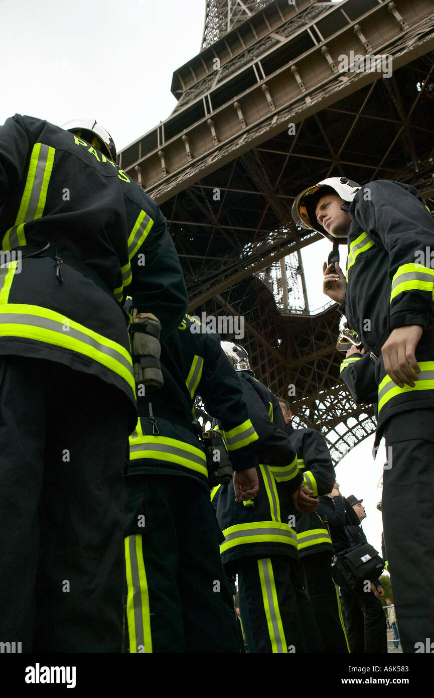 French firemen in front of the Eiffel tower in Paris France August 2004 ...