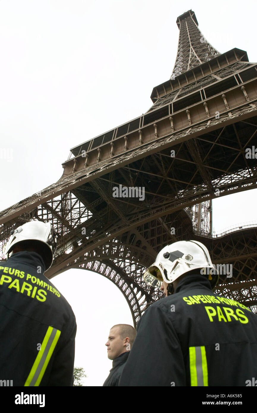 French firemen in front of the Eiffel tower in Paris France August 2004 ...