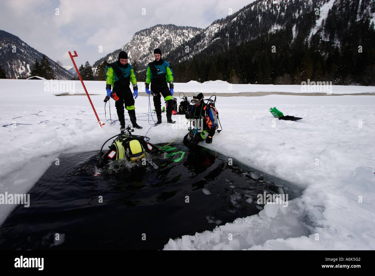 scuba diver with safety rope in ice hole on a frozen lake Stock Photo ...
