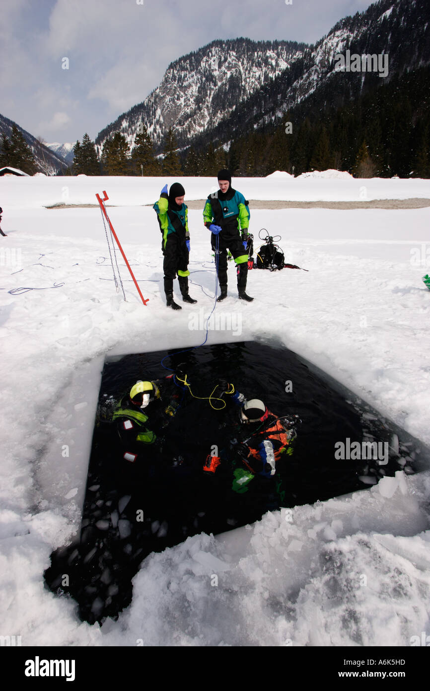 scuba diver with safety rope in ice hole on a frozen lake Stock Photo ...