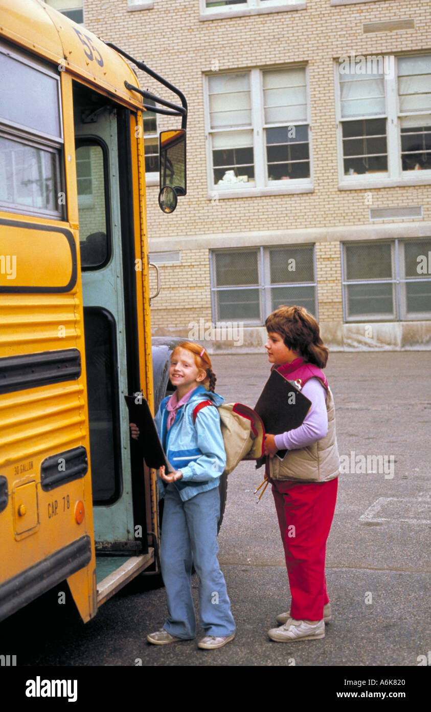 Children entering School Bus Stock Photo - Alamy