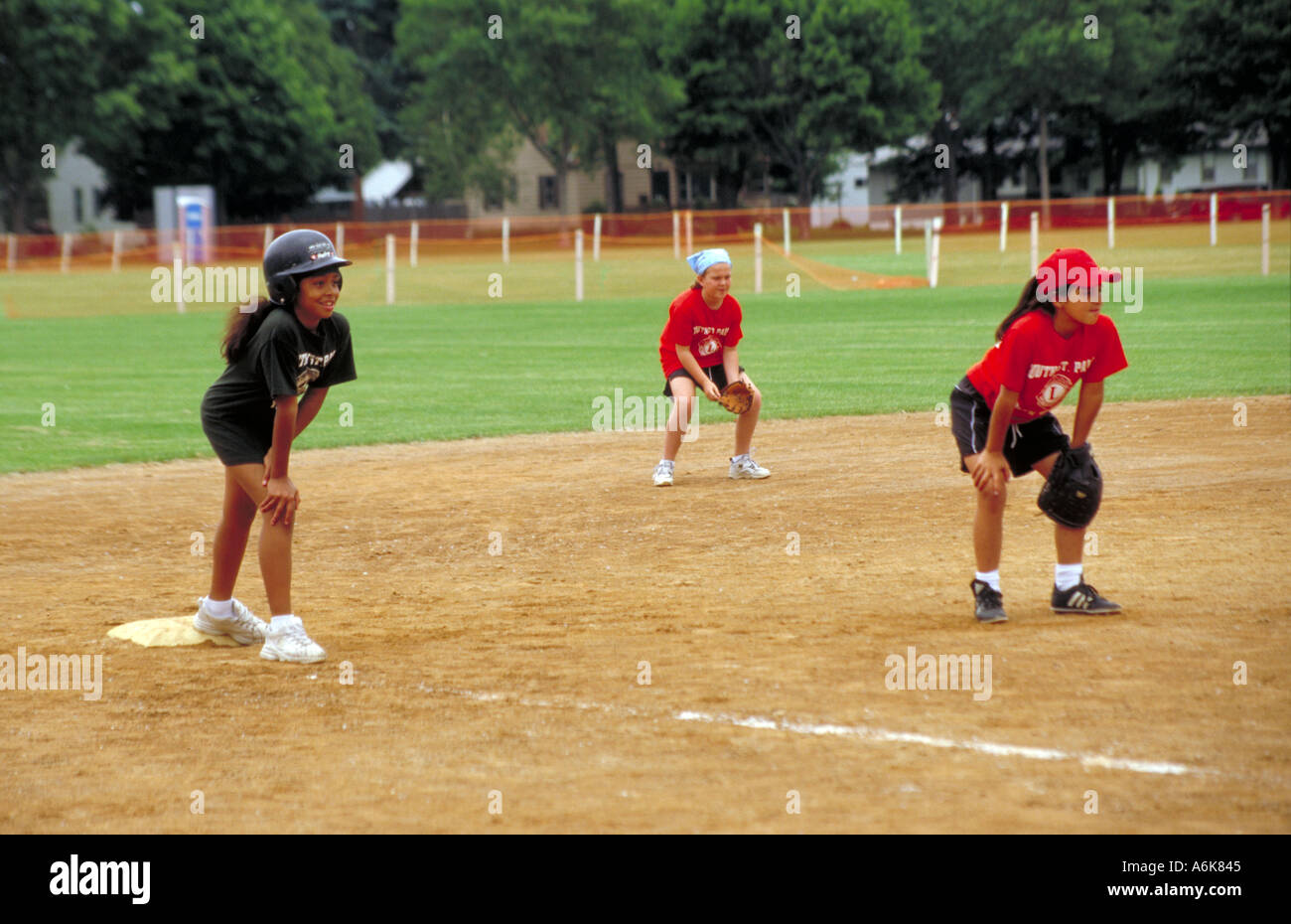 Girls playing softball hi-res stock photography and images - Alamy