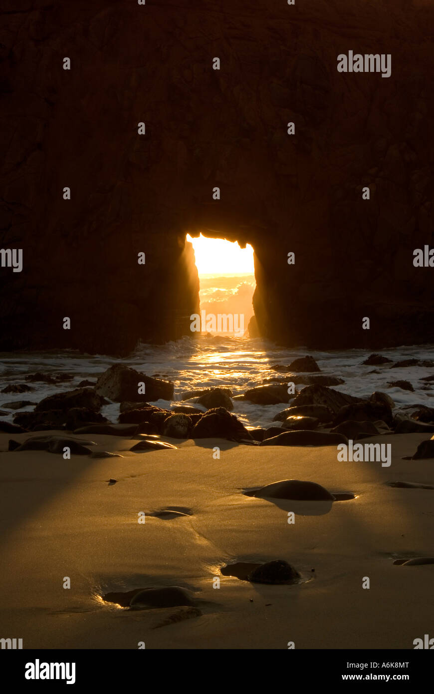Light glowing through Arch Rock at Pfeiffer Beach Big Sur Stock Photo ...