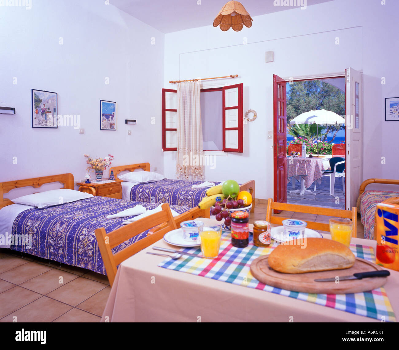 INTERIOR OF A SIMPLE GREEK STUDIO ACCOMODATION WITH TABLE MADE UP FOR ...