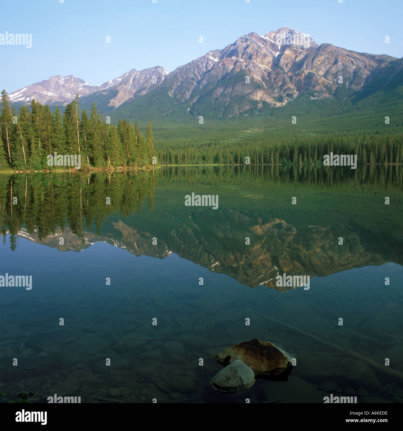 Pyramid Mountain reflecting in Pyramid Lake just north of Jasper ...