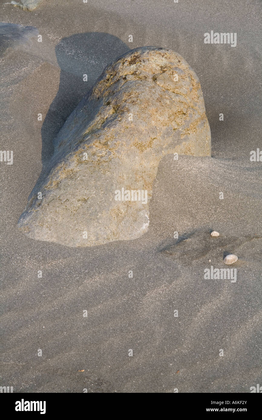 Rock and windblown sand Stock Photo - Alamy
