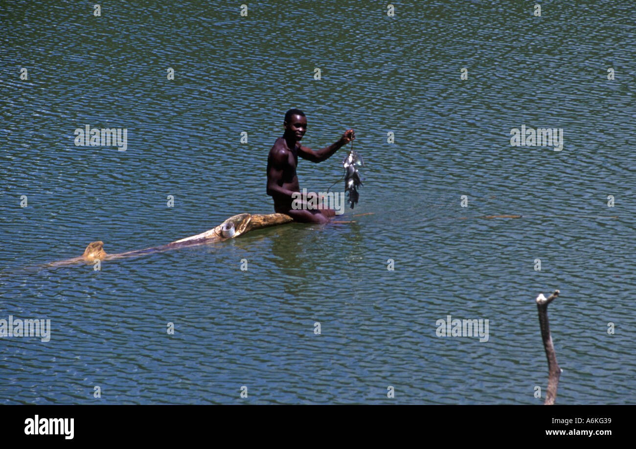 An African boy show us his fish catch in a lake ARUSHA TANZANIA Stock ...