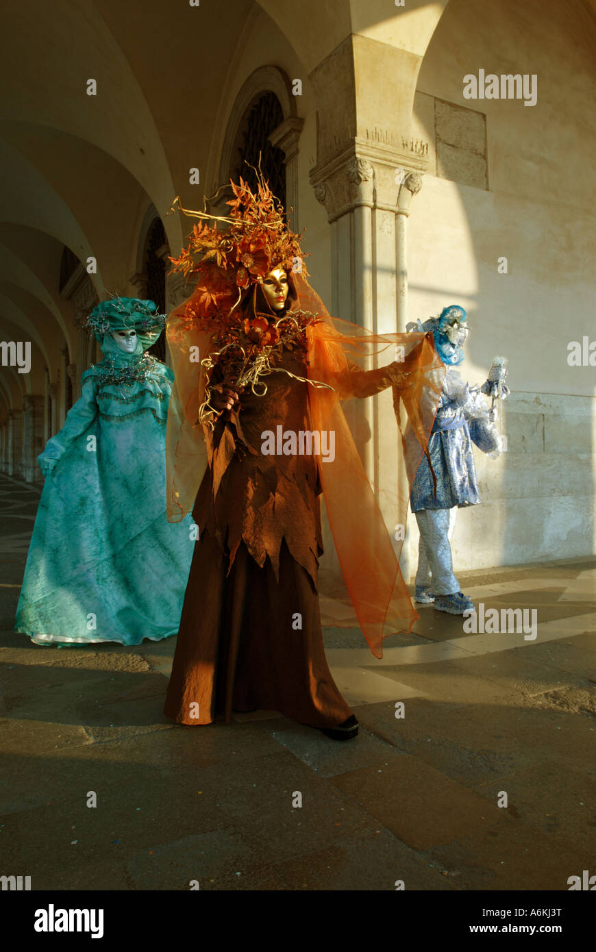 3 Costumed Revelers Posing in front of the Doges Palace Venice during ...