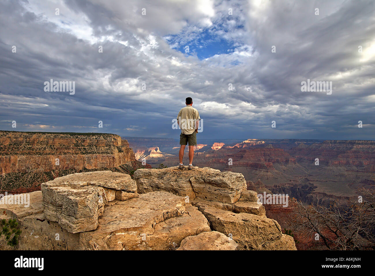 Single hiker reflecting on Peak in Grand Canyon at sunrise Stock Photo ...