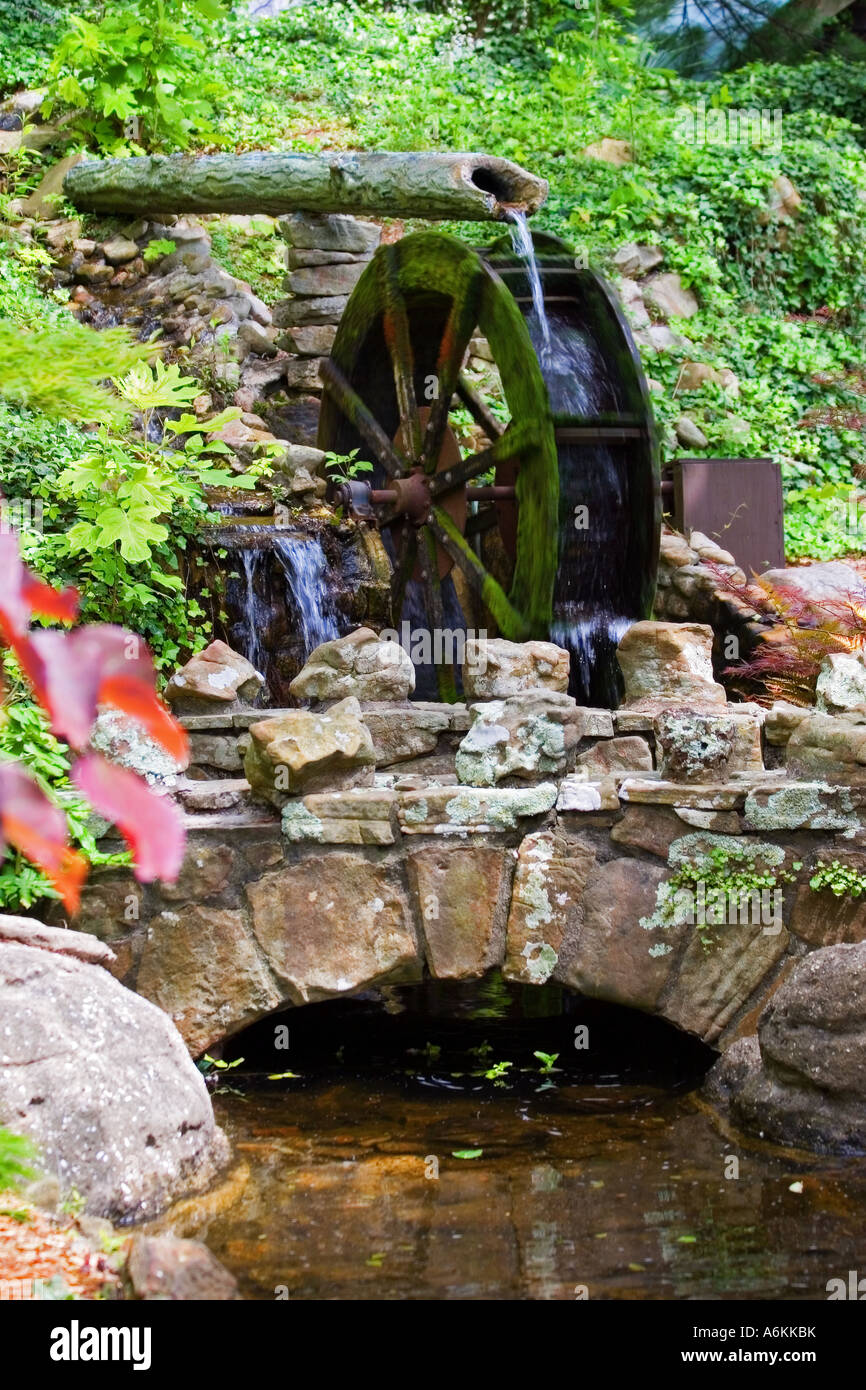 Watermill with waterfall and garden Stock Photo - Alamy