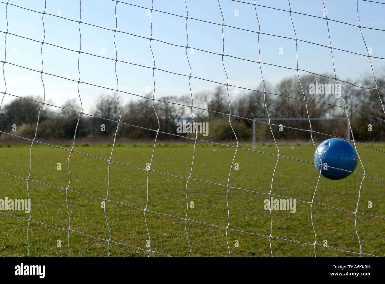 Football in goal Stock Photo - Alamy