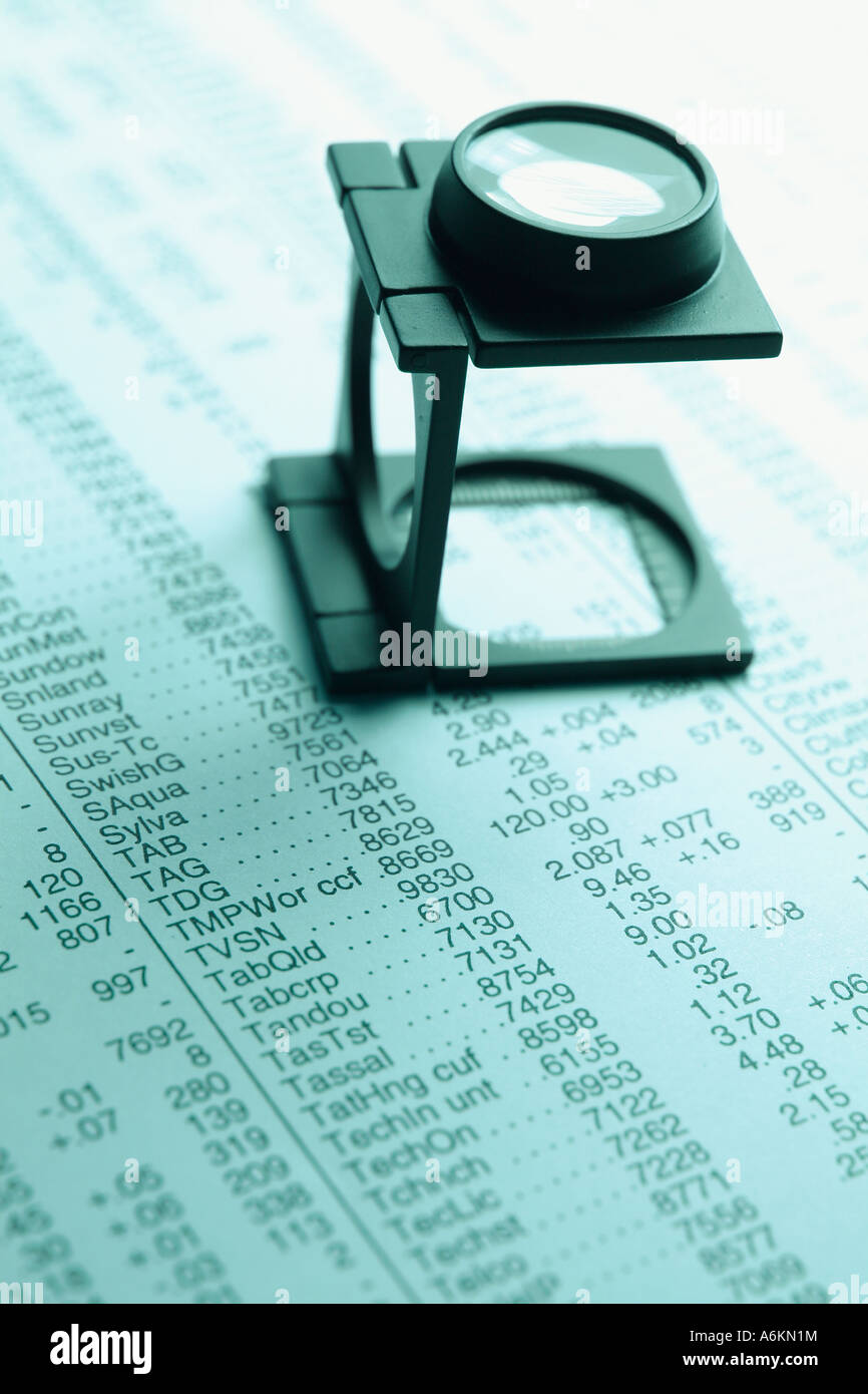 Magnifying Glass on Stock Quotes Stock Photo - Alamy