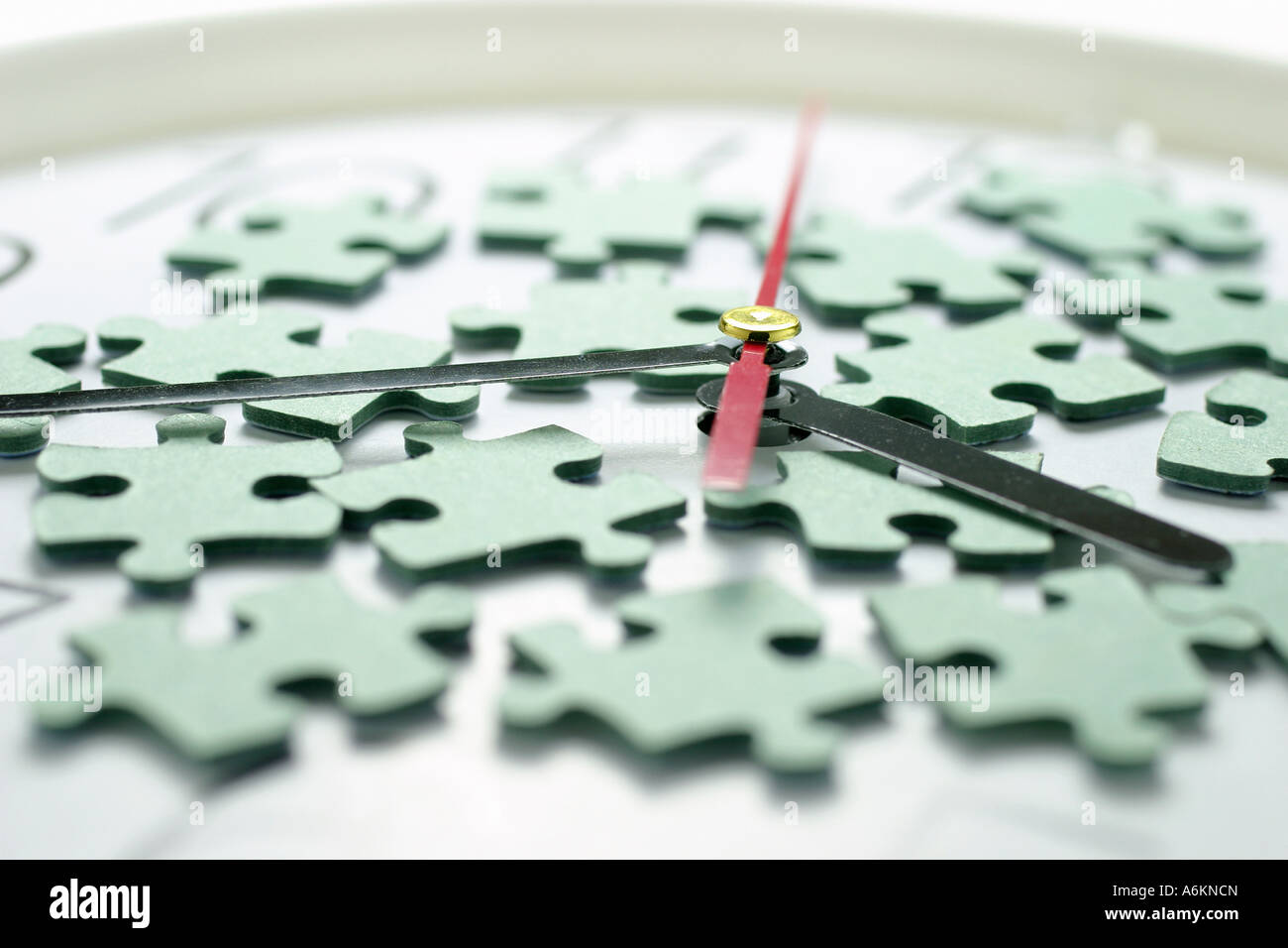 Jigsaw Puzzle Pieces on Clock Stock Photo - Alamy