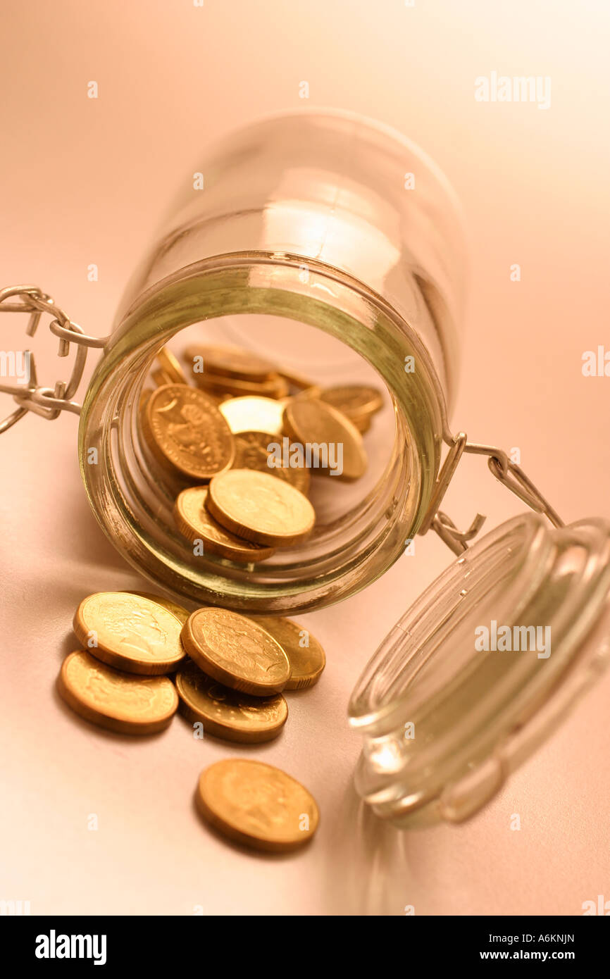 Coins in Glass Jar Stock Photo - Alamy