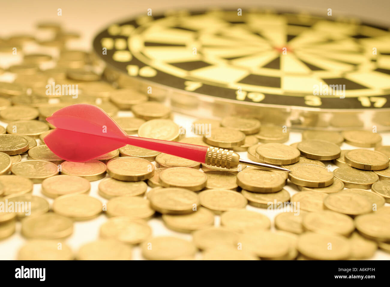 Coins and Dart on Dartboard Stock Photo - Alamy