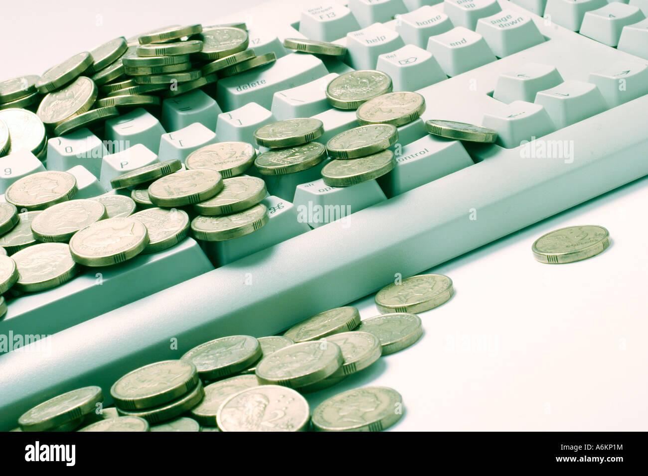 Coins on Computer Keyboard Stock Photo - Alamy