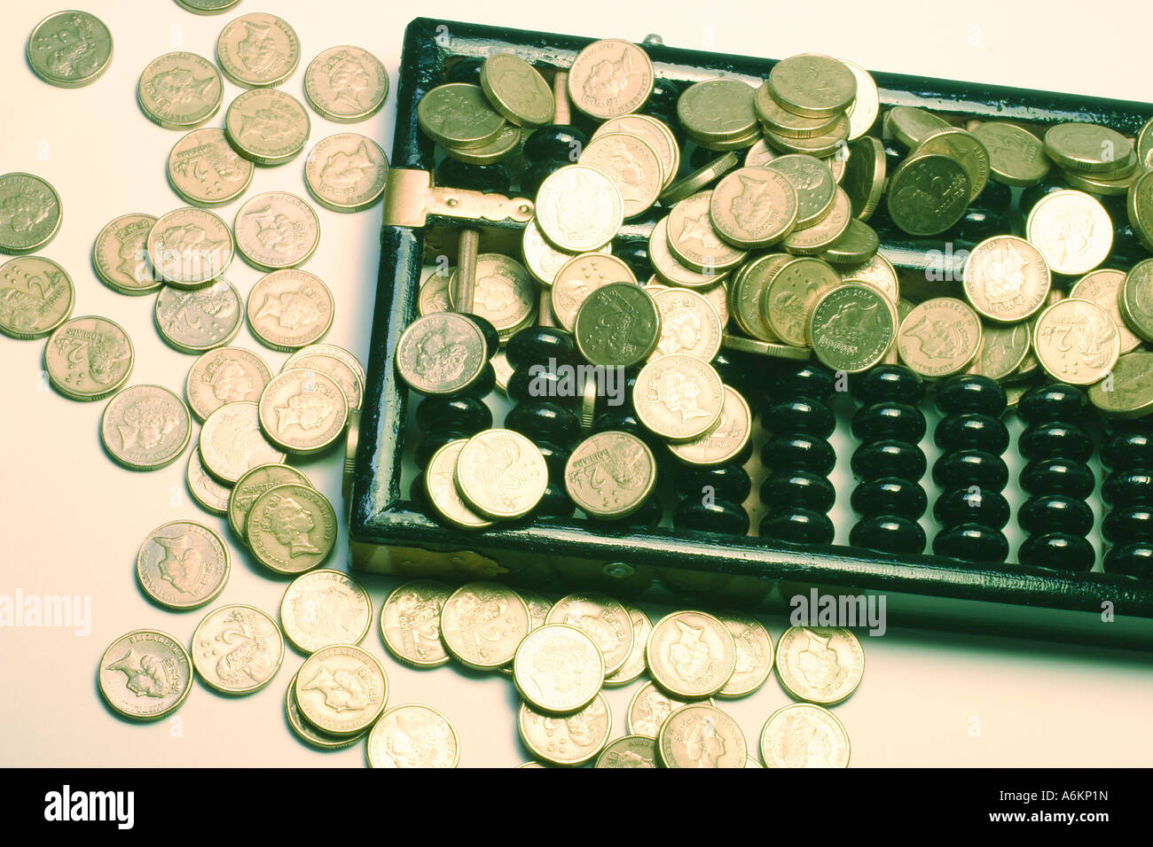 Coins on Abacus Stock Photo - Alamy