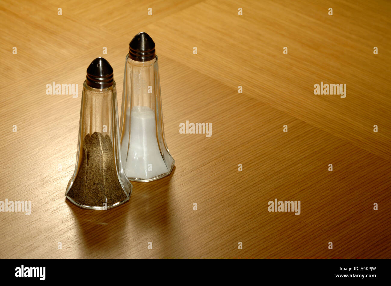 Salt pepper on a table Stock Photo - Alamy