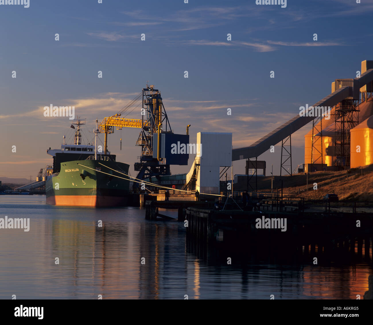 An ore carrier ship loads at Alcan in Port of Blyth Northumberland ...