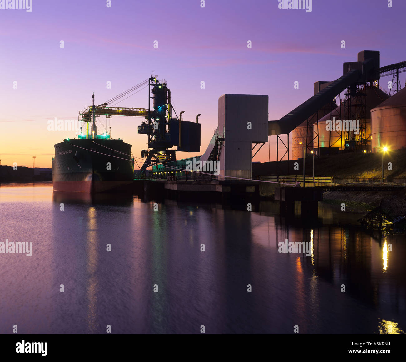 An ore carrier ship loads at Alcan in Port of Blyth Northumberland ...