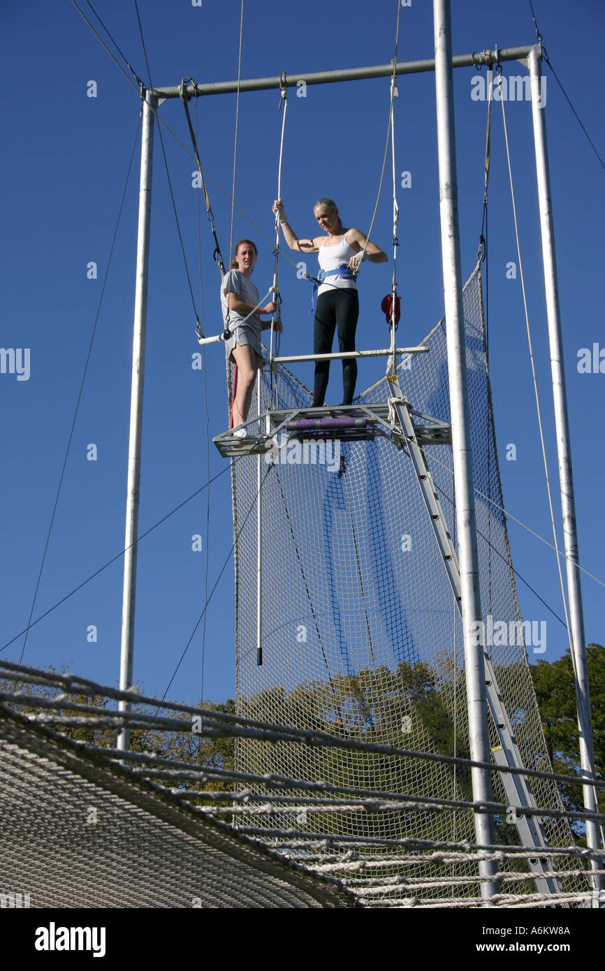 Woman trapeze artist waits on platform Stock Photo - Alamy