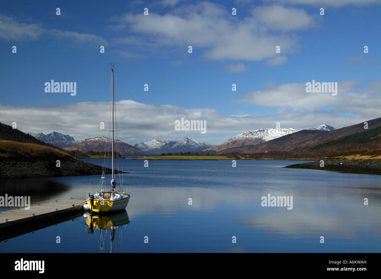 Lone yacht reflected in Loch Leven, Ballachulish, Lochaber, Scotland ...