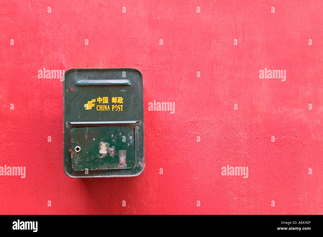 Chinese postal box on red wall China Stock Photo - Alamy
