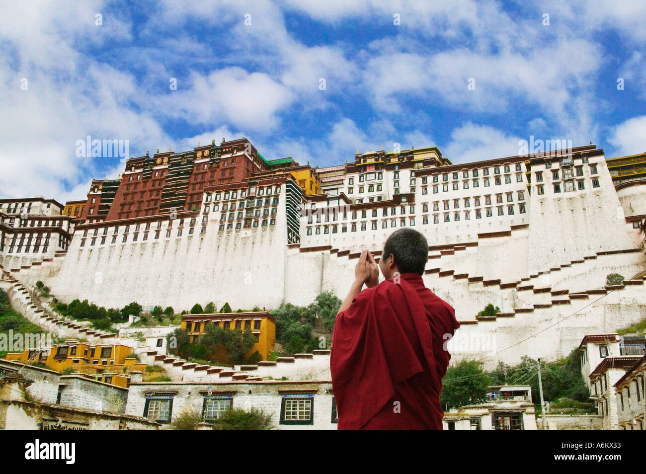 Tibetan monk with Potala Palace Lhasa Tibet China Stock Photo - Alamy