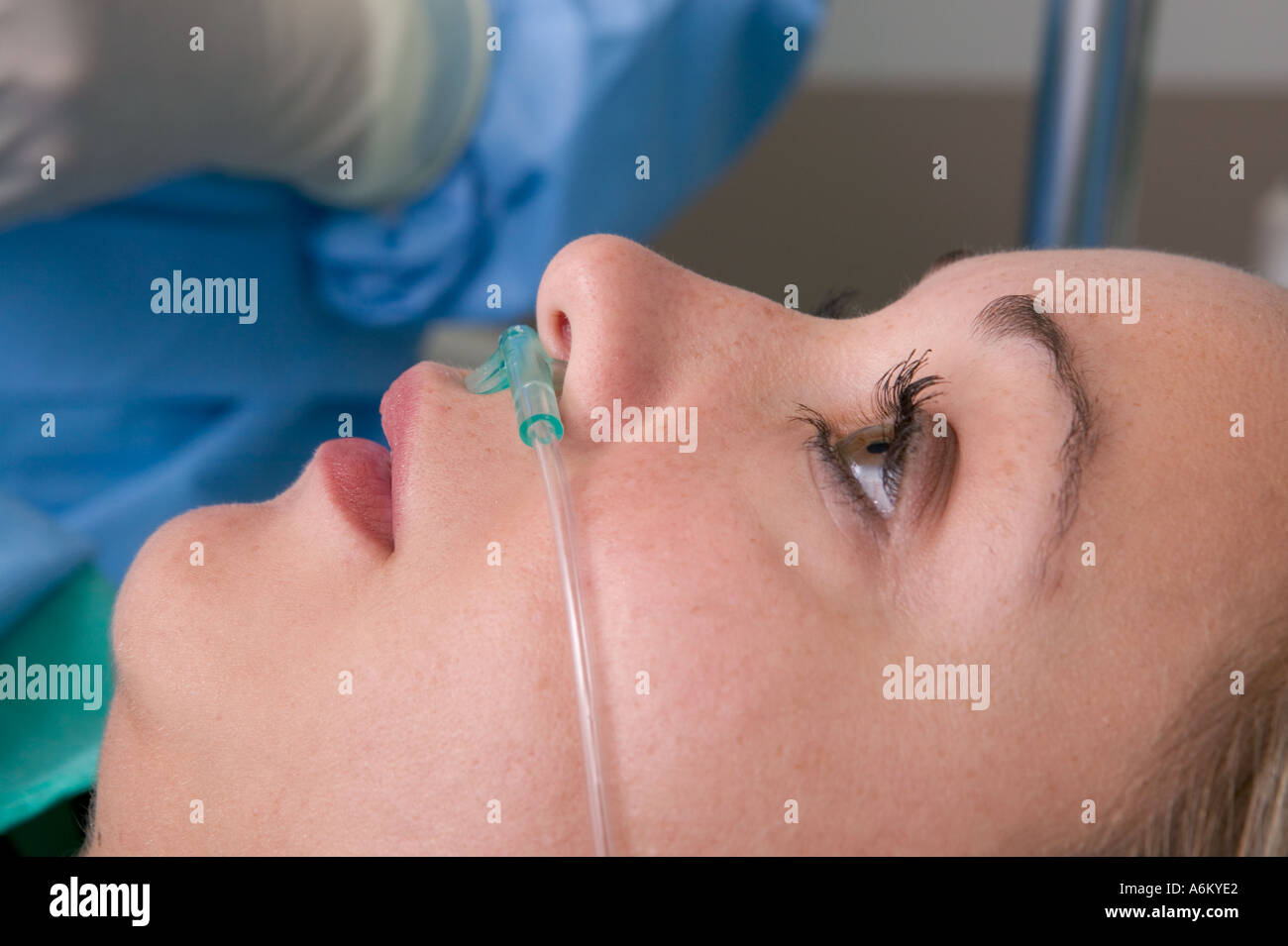 Young female patient during surgery with oxygen tubes in nose Stock ...