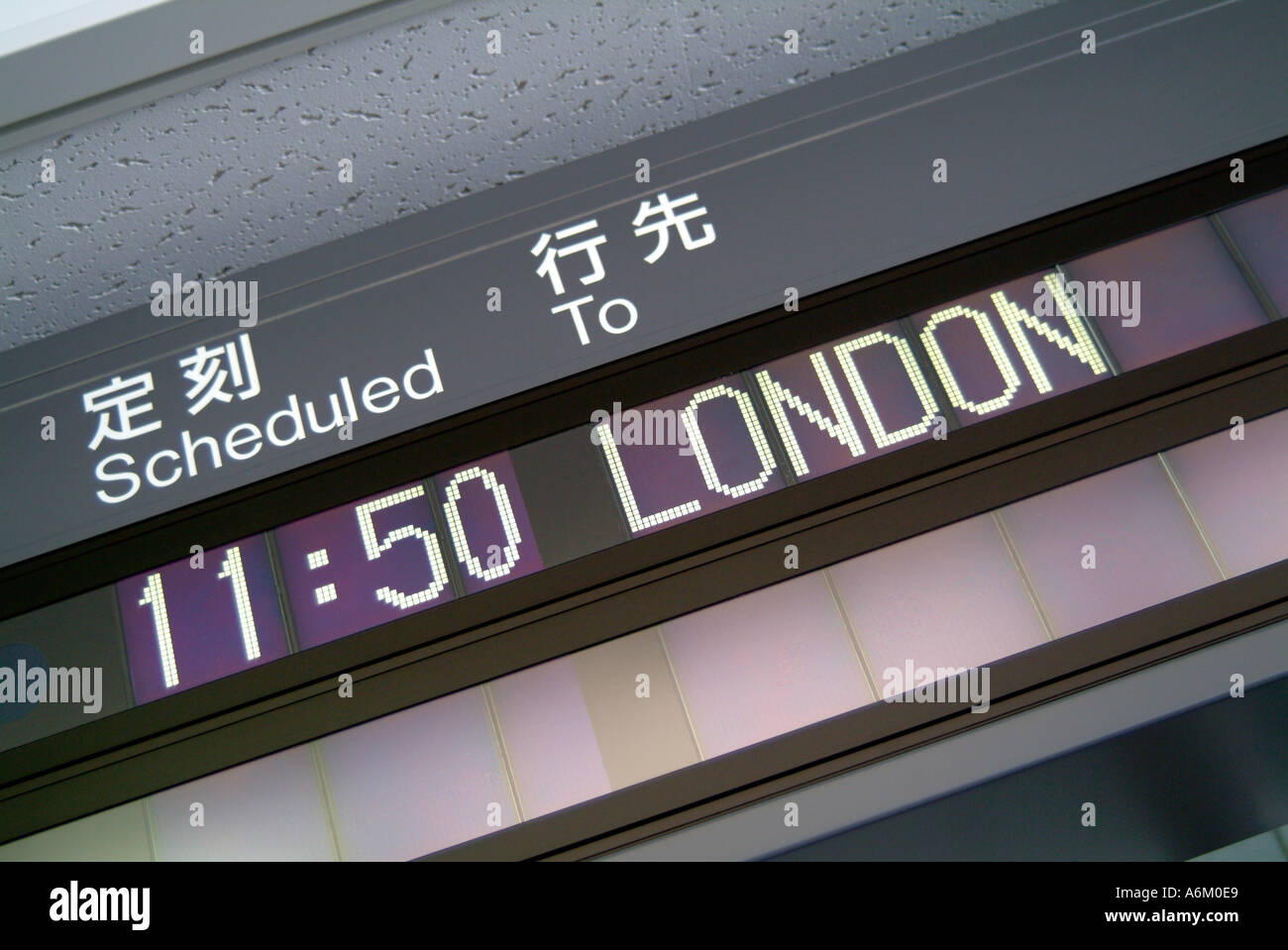 Time and destination on gate sign in English and Japanese at Kansai ...