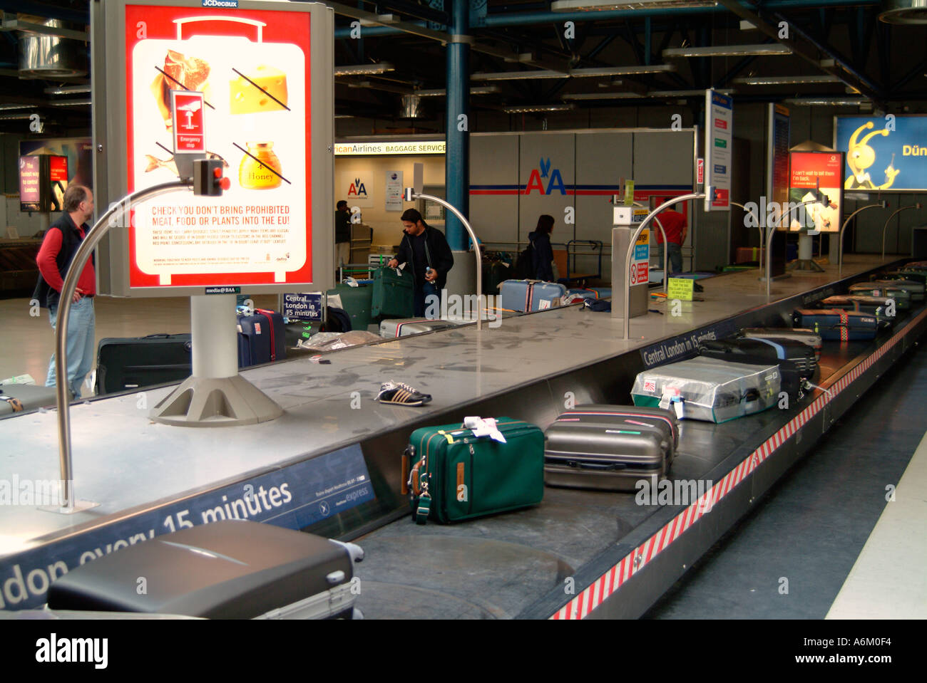 Baggage going around on collection belt Terminal 3 London Heathrow ...