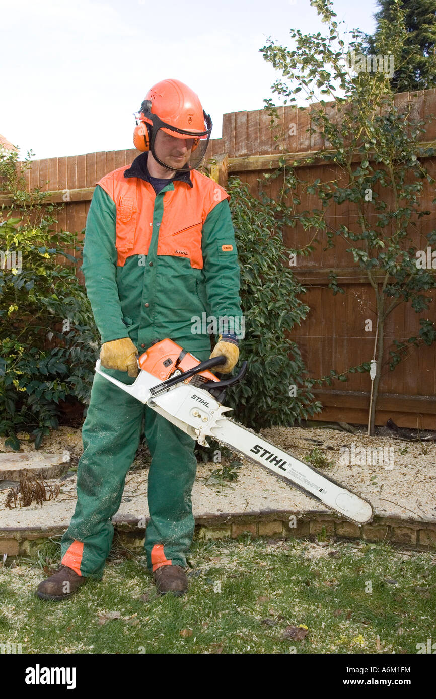man holding chainsaw wearing full protective safety clothing Stock ...
