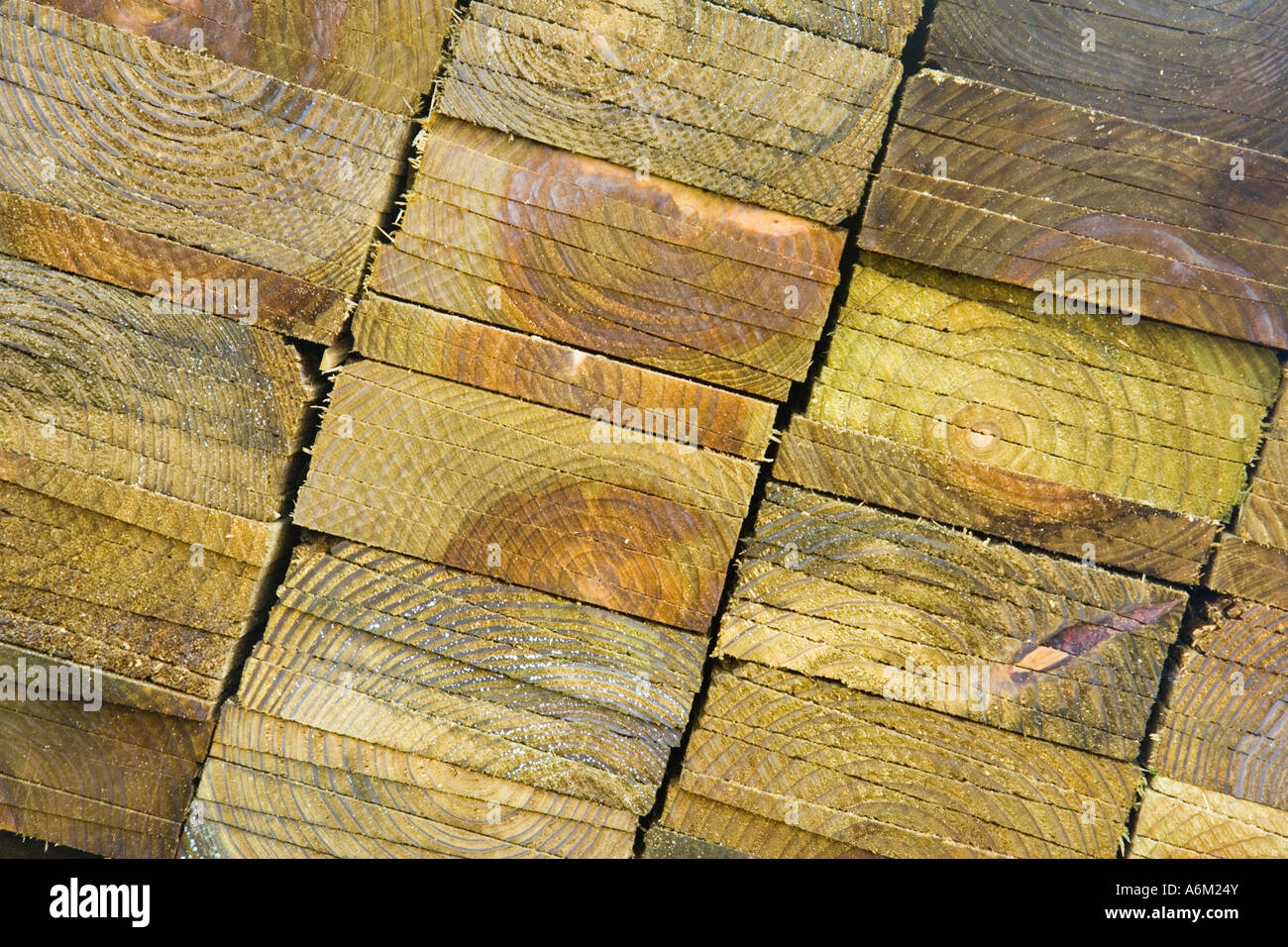 end view of stack of timber Stock Photo - Alamy