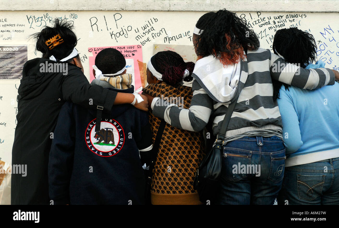 Friends and family of Kodjo Yenga perusing the wriiten tributes near ...