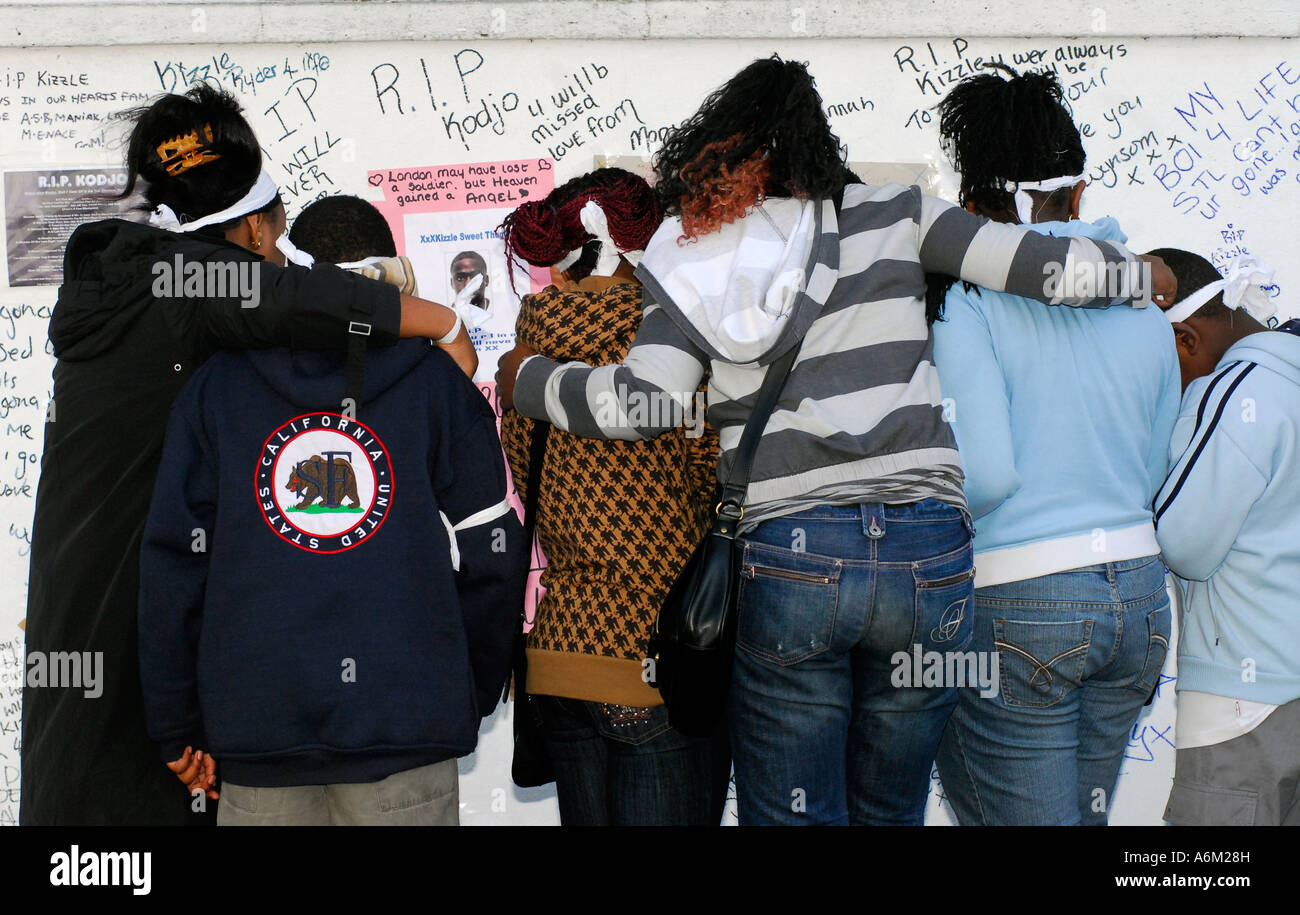 Friends and family of Kodjo Yenga perusing the wriiten tributes near ...