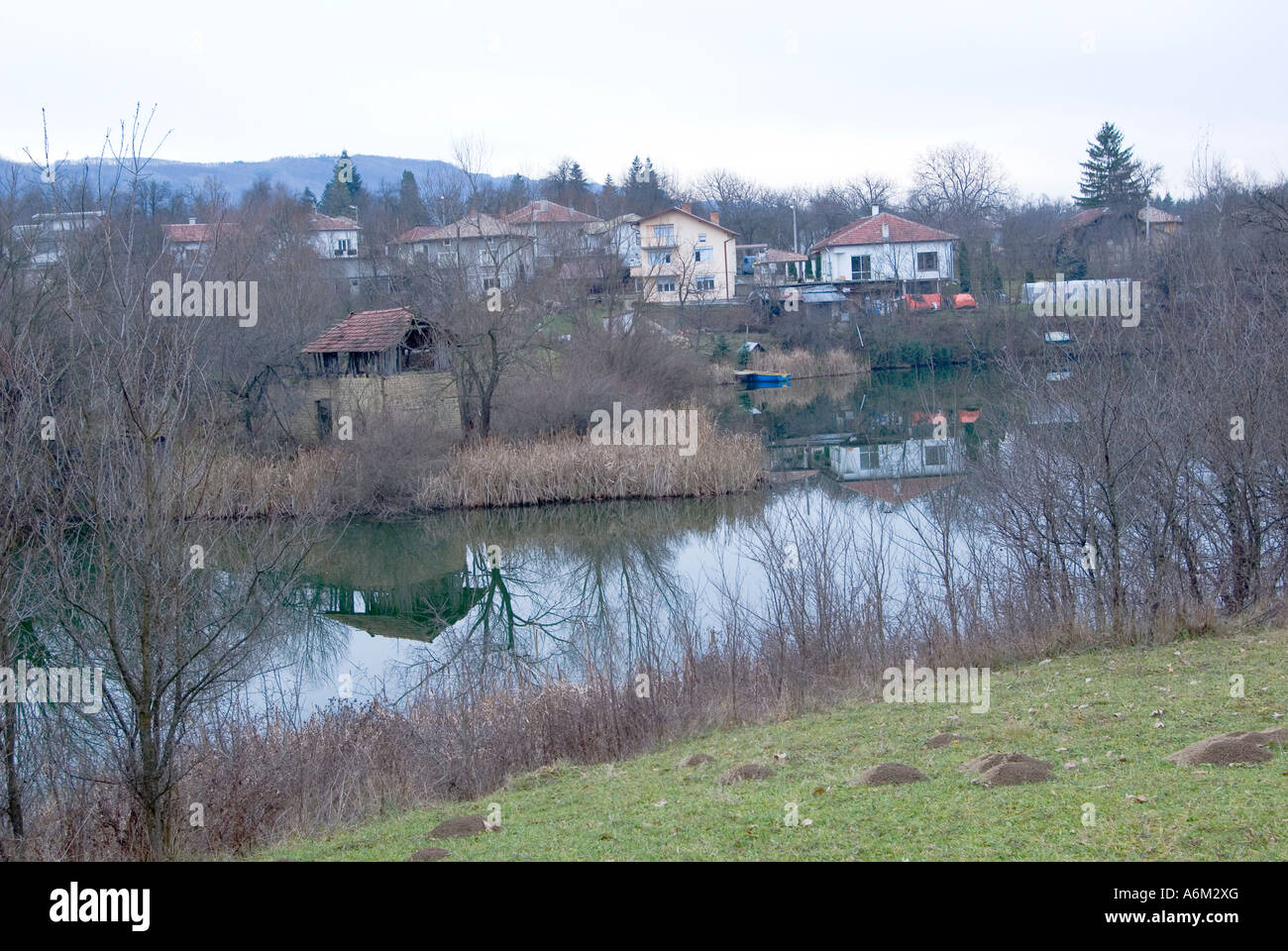 Bulgarian village on the lake Stock Photo - Alamy