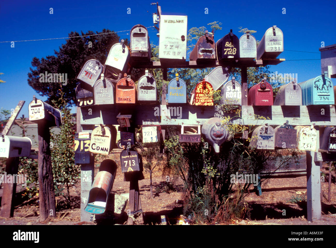 Assorted colorful mailboxes in rural setting Stock Photo - Alamy