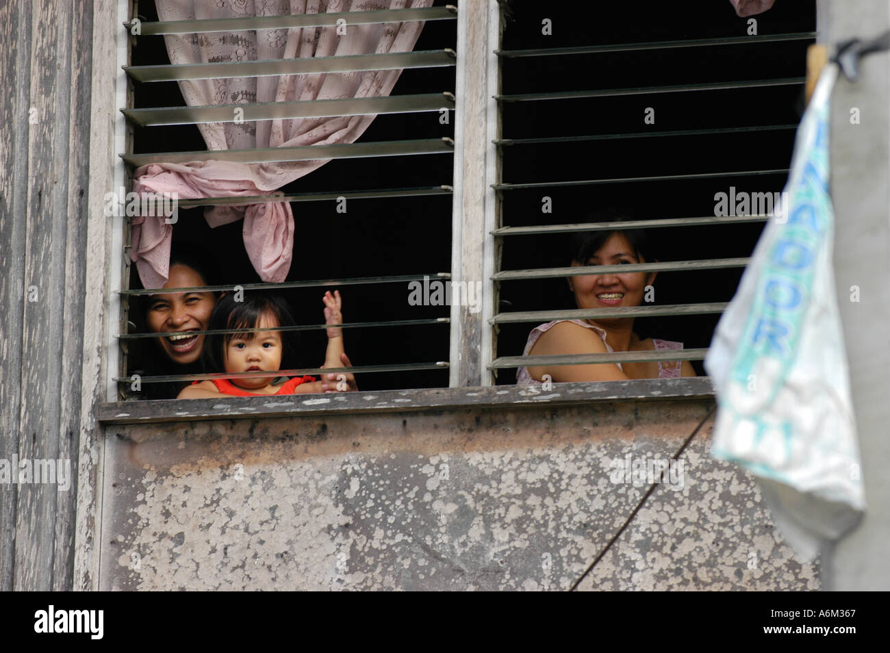 People looking out of window Stock Photo - Alamy