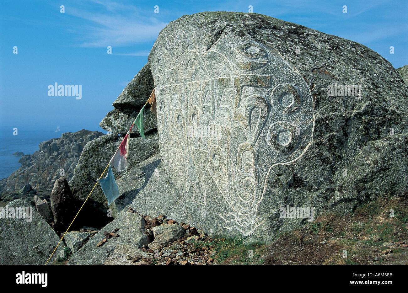 Stone carved by a Buddhist Monk on the Eperquerie on Sark Island Stock ...