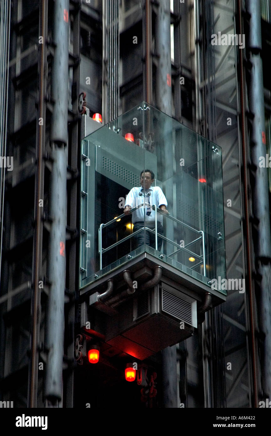 Office worker in glass elevator at Lloyds of London Stock Photo - Alamy