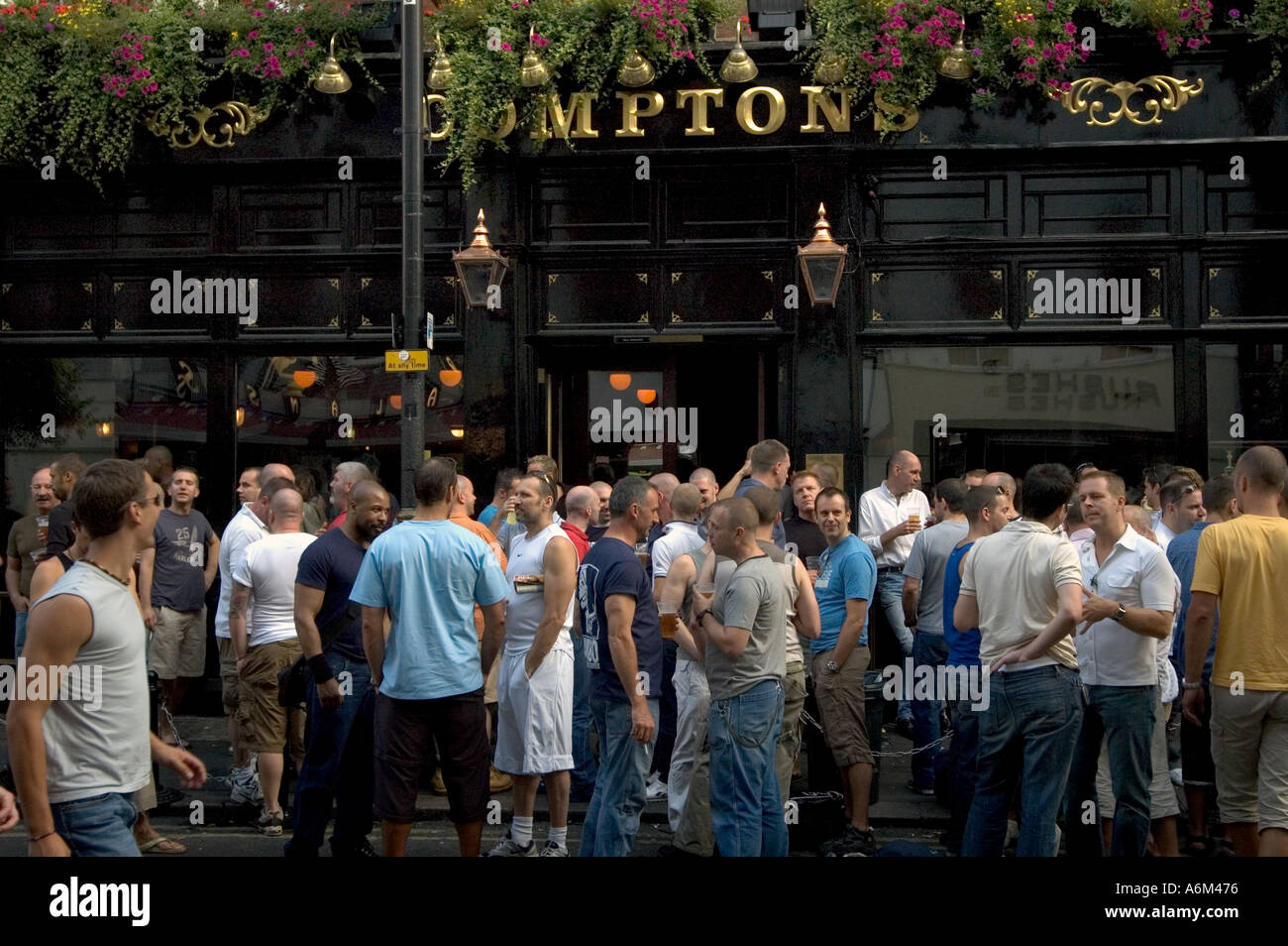 Men having a drink outside the Comptons pub in Old Compton St Soho ...