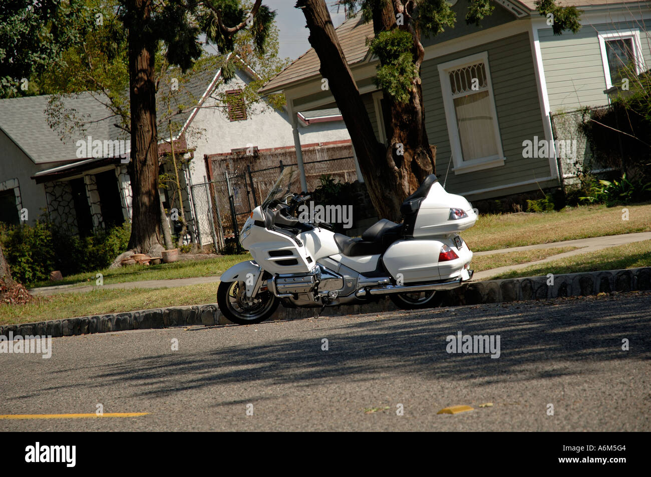 White Honda Goldwing cruiser motorcycle parked on the street Stock ...