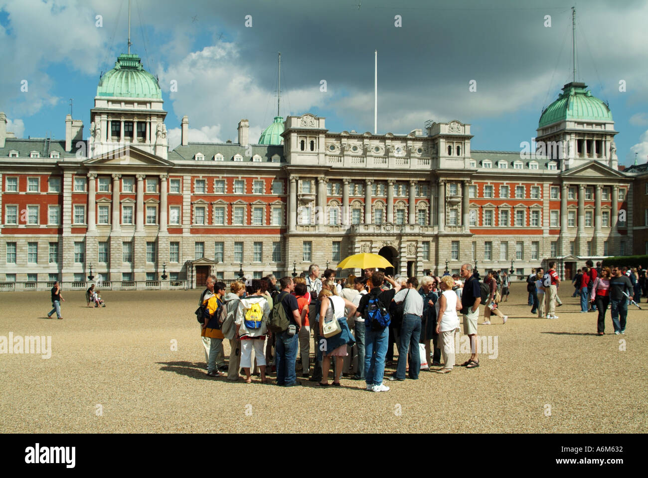 Tourists on Horse guards parade ground sightseeing tour guide yellow ...