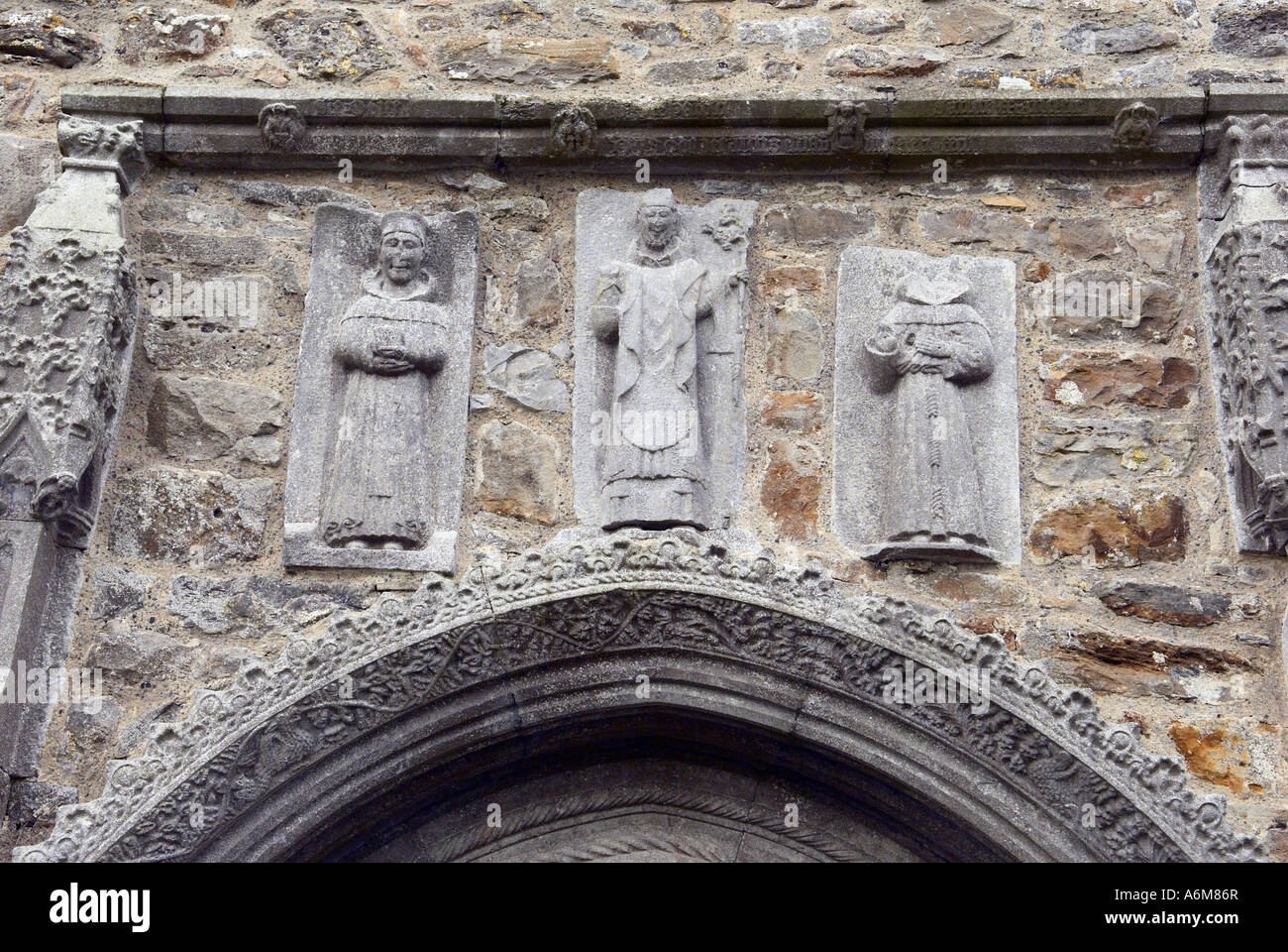 Fine detail including carvings of three saints Dominic Patrick and ...