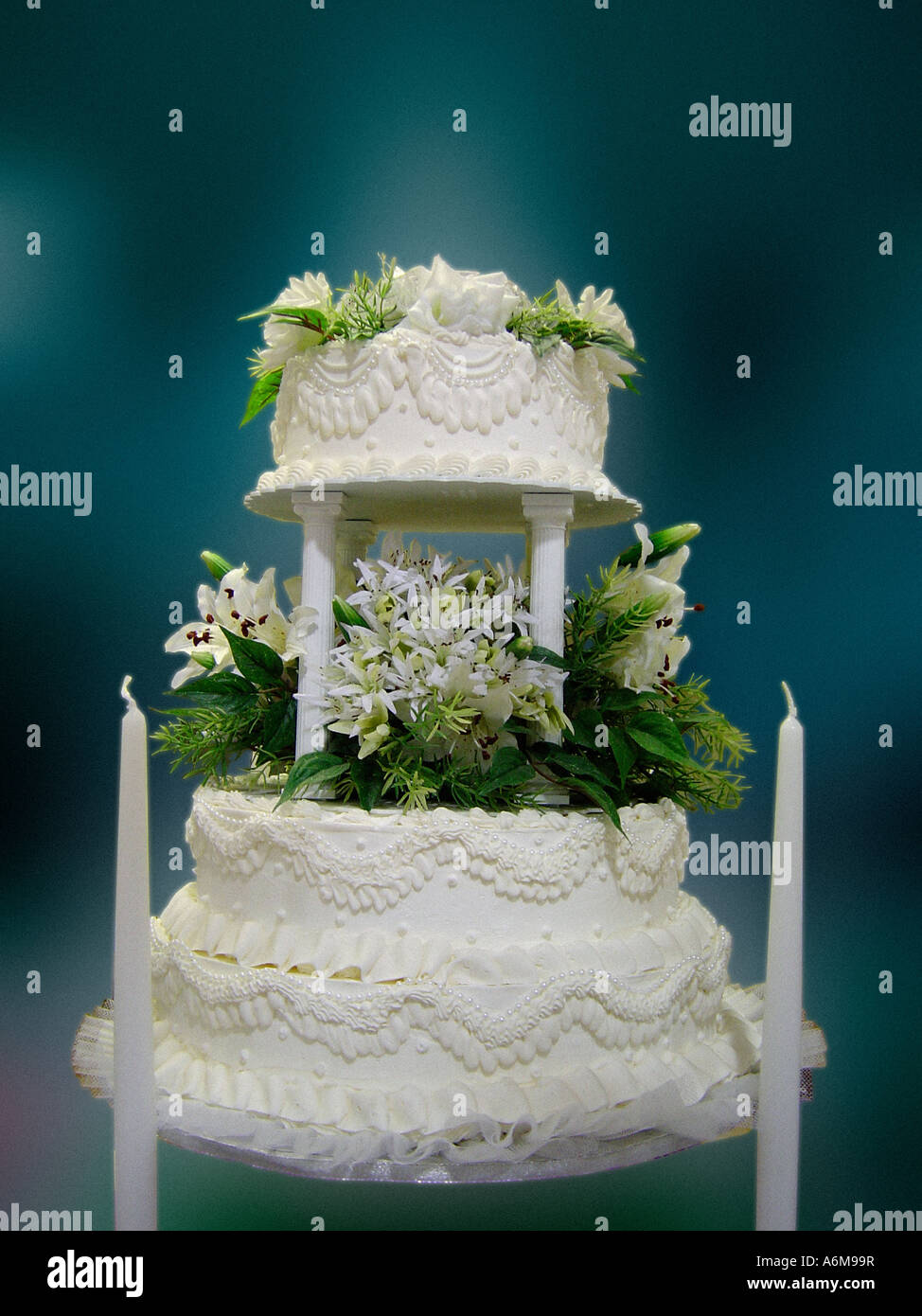Multiple Tiered White Wedding Cake with Candles and Flowers [Tighter ...